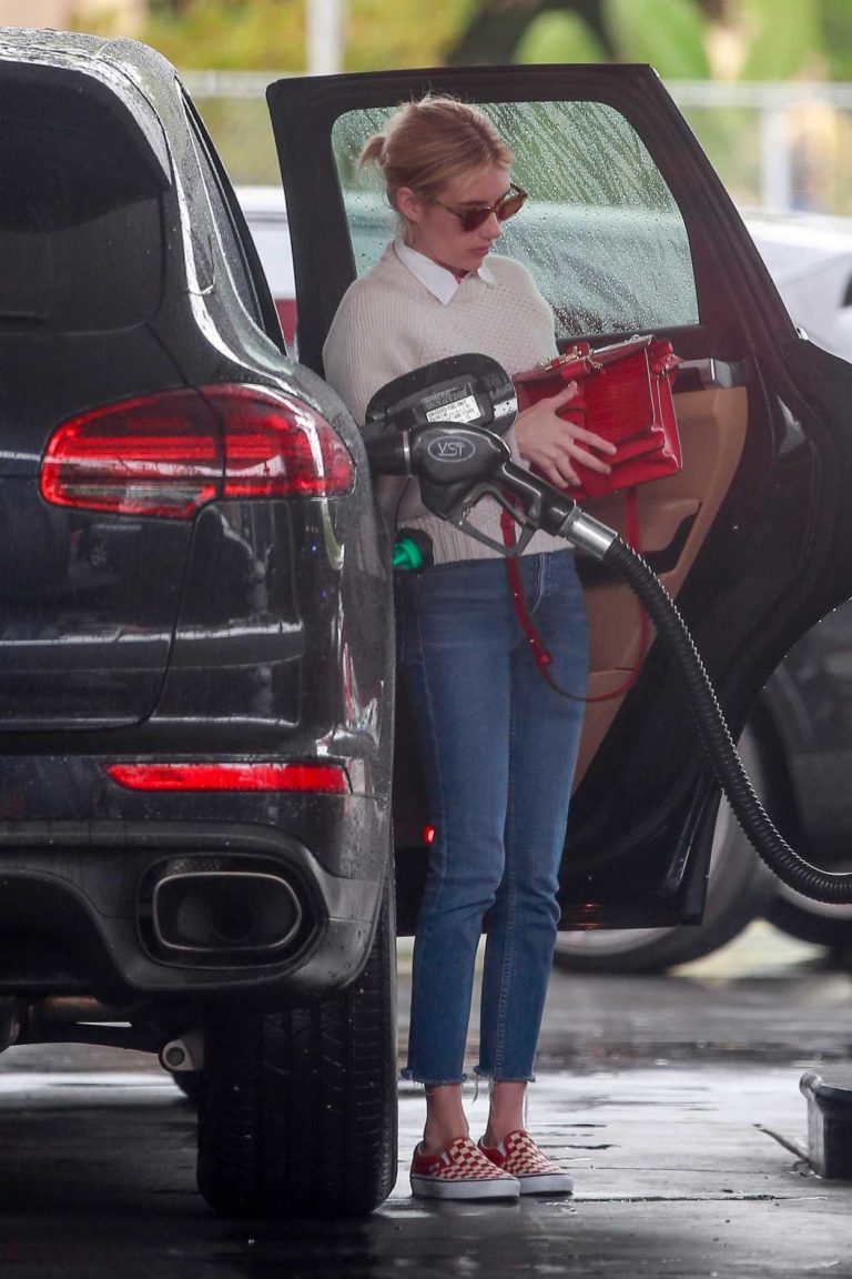 Emma Roberts in a Beige Sweater Puts Gas in Her Car in Los Angeles 03 ...