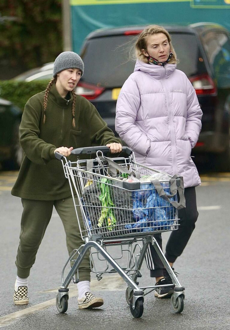 Erin Doherty in a Grey Knit Hat Shops at a Budget Supermarket Lidl with ...