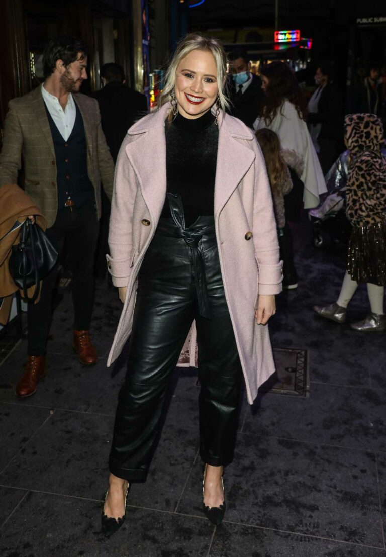 Amy Walsh in a Pink Coat Arrives at the Press Night for A Christmas ...